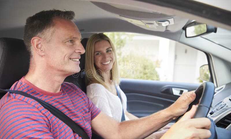 Mature Couple Sitting in Car on Road Trip Stock Image - Image of driver ...