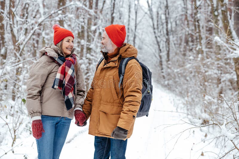 Mature Couple in a Snowy Forest Feeling Excited Stock Image - Image of ...