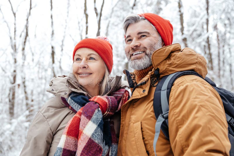 Mature Couple in a Snowy Forest Feeling Excited Stock Photo - Image of ...