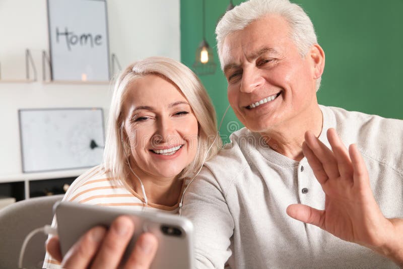 Mature Couple Using Video Chat on Mobile Phone Stock Photo - Image of ...