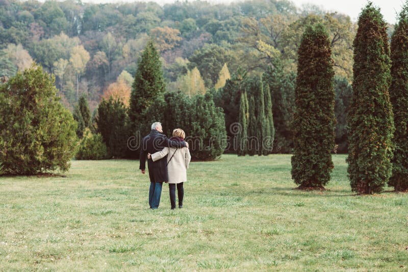 Mature Couple Walking in Autumn Park Stock Photo - Image of green ...