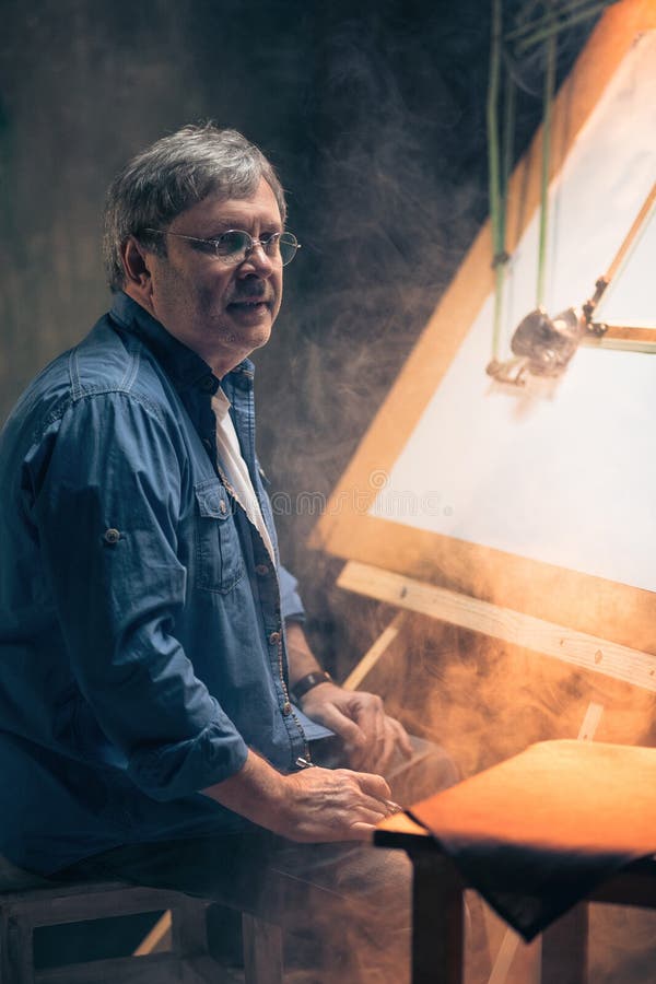 The Mature Creative Engineer Working with Project on Drawing Board ...