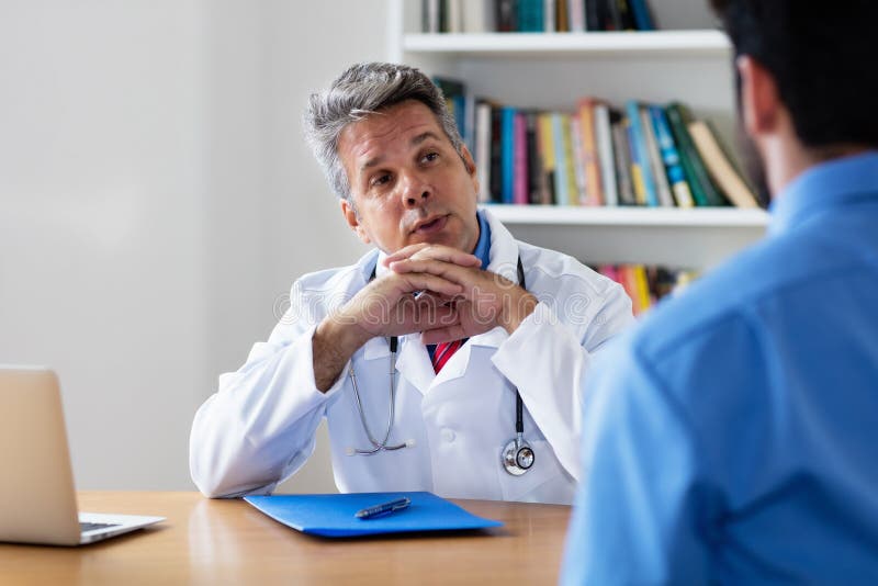 Mature Doctor Thinking about Problems of Patient Stock Photo - Image of ...