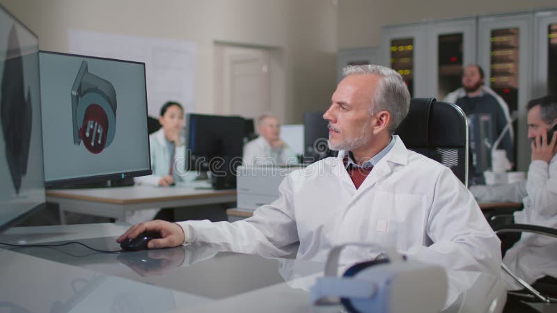 Mature Engineer in Lab Coat Work on Computer Designing 3d Model Stock ...