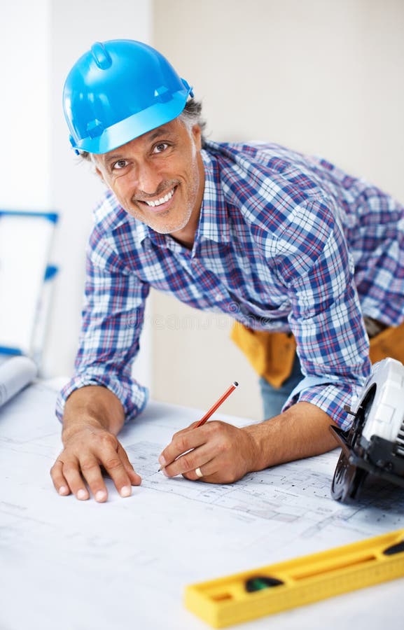 Mature Engineer Working on Blueprint. Portrait Smiling Architect ... Mature Engineer Working on Blueprint. Portrait Smiling Architect ...