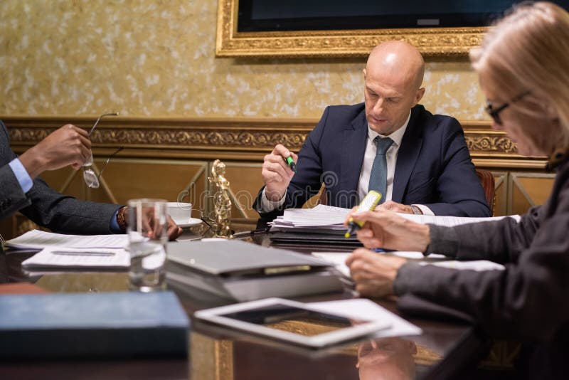 Mature and Experienced Lawyers Highlighting the Main Points of ...