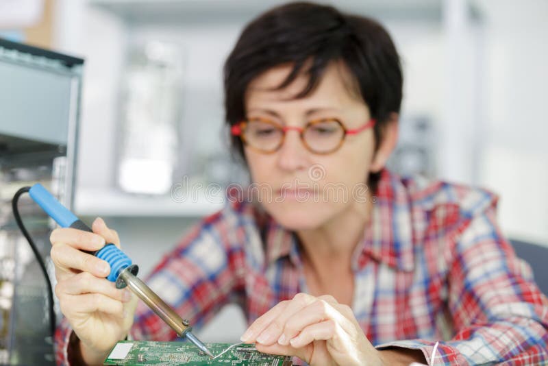 Mature Female Electronic Engineer Soldering Computer Stock Image ...
