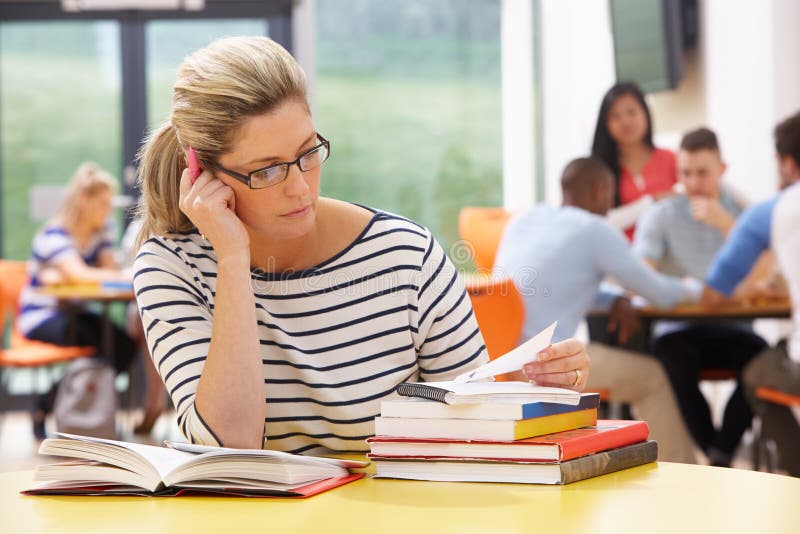 Mature Female Student Studying in Classroom with Books Stock Photo ...