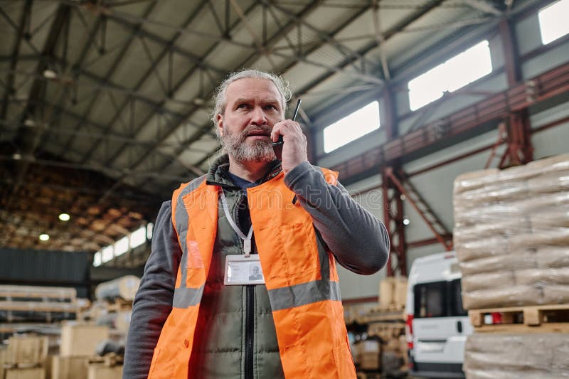 Foreman Speaking on the Radio in Warehouse Stock Image - Image of ...