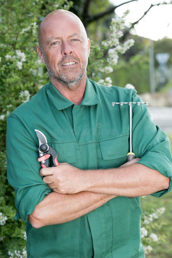 Mature Gardener Posing at Garden Stock Photo - Image of landscaping ...
