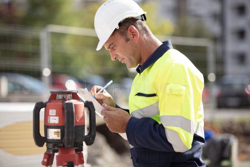 Mature Geometer Working on Construction Site Stock Photo - Image of ...