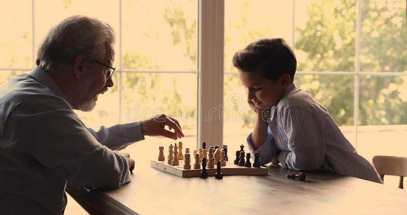 Mature Grandfather Playing Chess with Small Grandson. Stock Video ... Mature Grandfather Playing Chess with Small Grandson. Stock Video ...