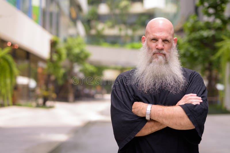 Mature Handsome Bald Bearded Man with Arms Crossed in the City Stock ... Mature Handsome Bald Bearded Man with Arms Crossed in the City Stock ...