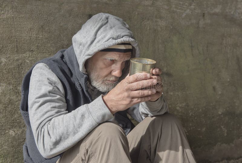 Mature Homeless Man Looking Fed Up, Holding an Empty Tin Can. Stock ...