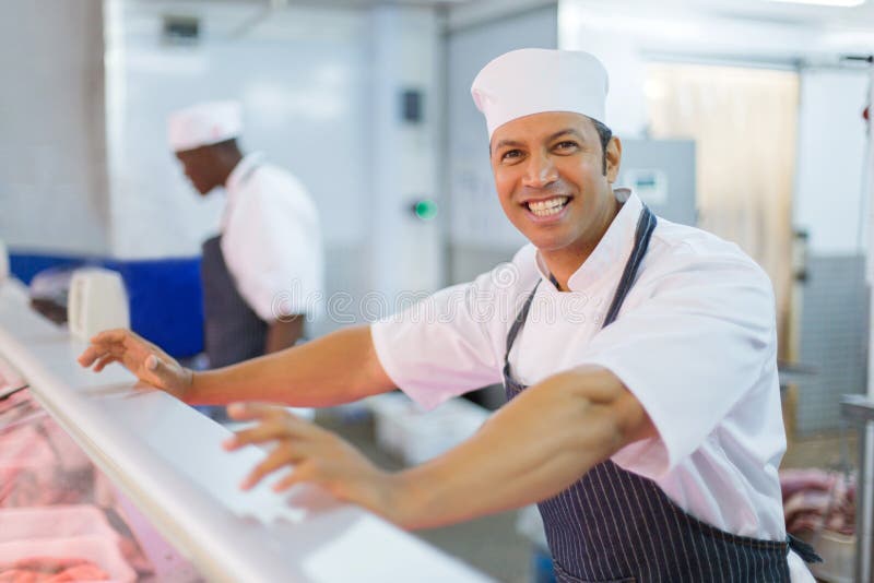 Mature Male Butcher Looking Stock Photo - Image of background, counter ...