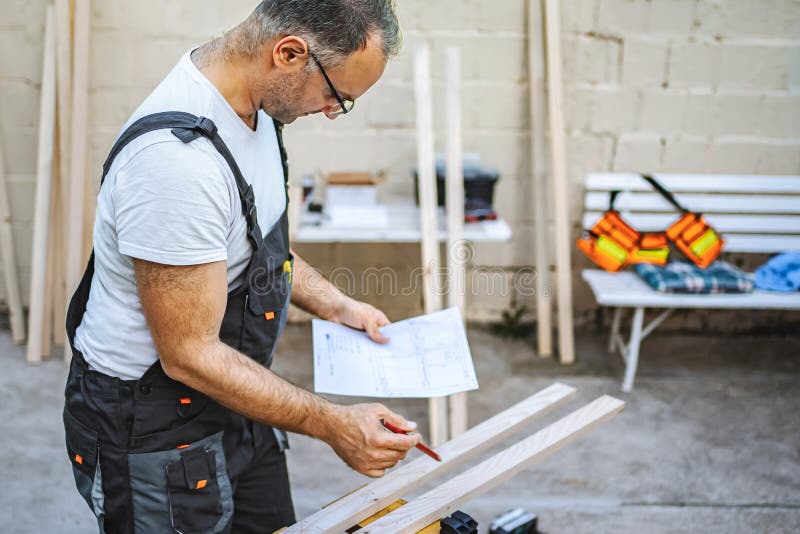 Mature Male Carpenter Working with Wooden Plank Outdoors Stock Photo - Image of males, craft ...
