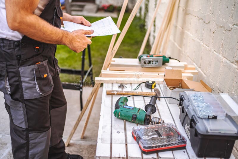 Mature Male Carpenter Working with Wooden Plank Outdoors Stock Photo ...