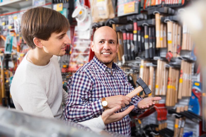 Mature Male Client and Young Salesman at Tooling Section Stock Photo ...