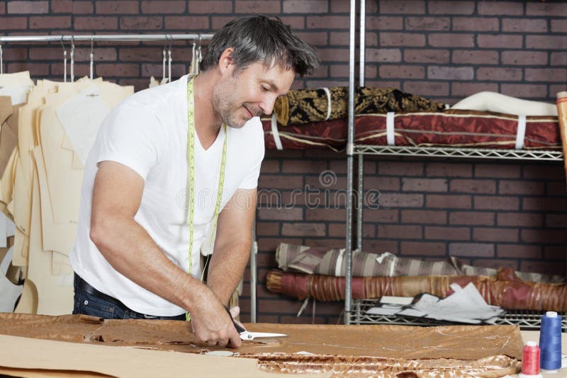 Mature Male Dressmaker Cutting Fabric in Design Studio Stock Image ...