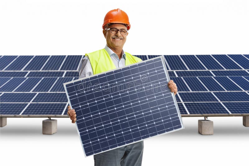 Male Engineer Posing with a Solar Panel and Workers Carrying Panels in ...