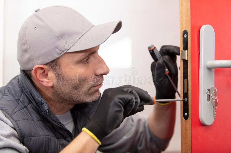 Mature Male Lockpicker Fixing Door Handle at Home Stock Image - Image ...