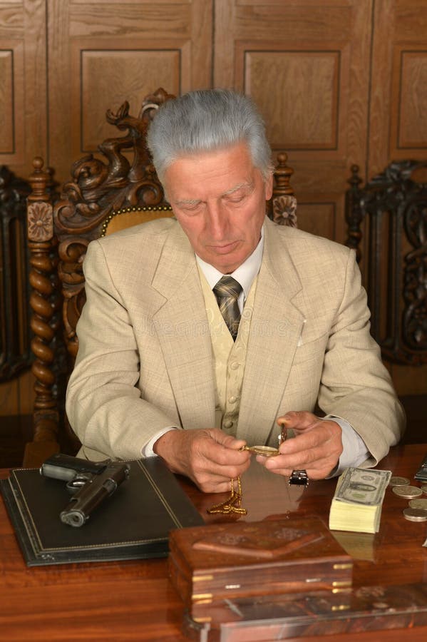 Mature male mafia boss stock photo. Image of pensive - 79309130