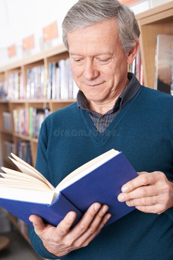 Mature Male Student Studying in Library Stock Photo - Image of book ...