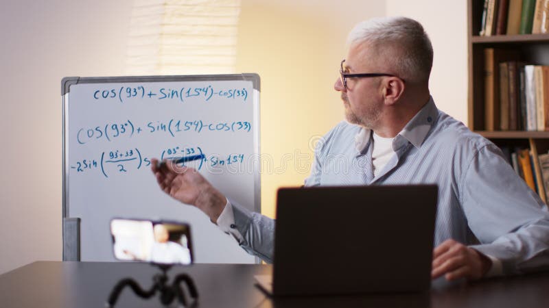Mature Male Teacher Having Online Class, Explaining Math Course for ...