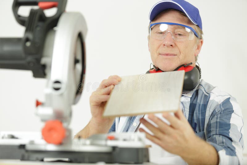 Mature Man Assessing Wood he Has Prepared with Circular Saw Stock Image ...