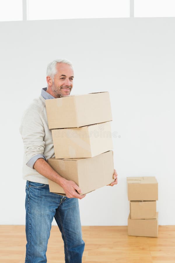 Mature Man Carrying Boxes in a House Stock Image - Image of standing ...