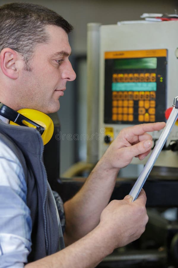 Mature Man with Clipboard at Factory Stock Image - Image of person ...