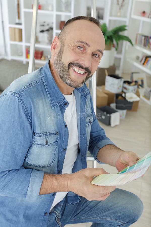 Mature Man Decorating House Stock Image - Image of happiness, oneperson ...