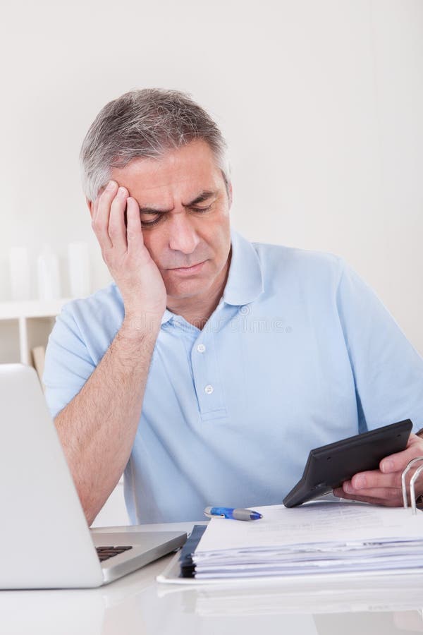 Mature man doing finances stock image. Image of problem - 53171645