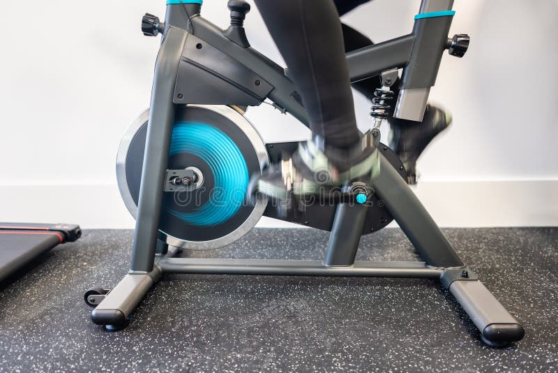 Mature Man Doing Leg Building on an Exercise Bike at Home. Stock Photo ...