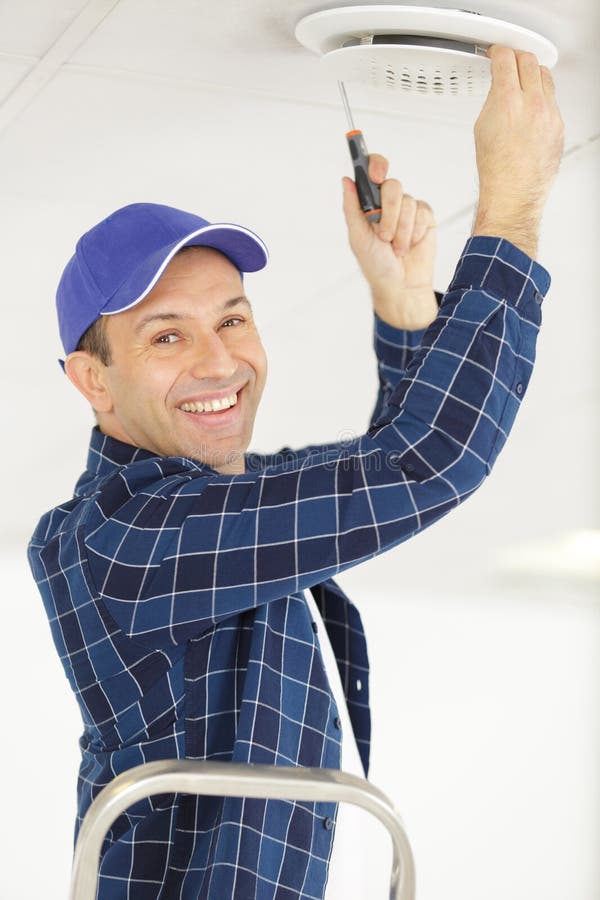 Mature Man Fitting Ceiling Vent Stock Photo - Image of tool, peakedcap ...
