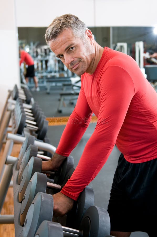 Mature man at gym stock image. Image of satisfaction - 17052649