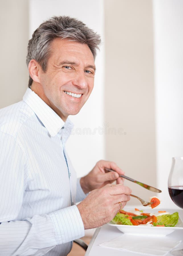 Mature Man Having Lunch at Home Stock Photo - Image of eating, clothing ...