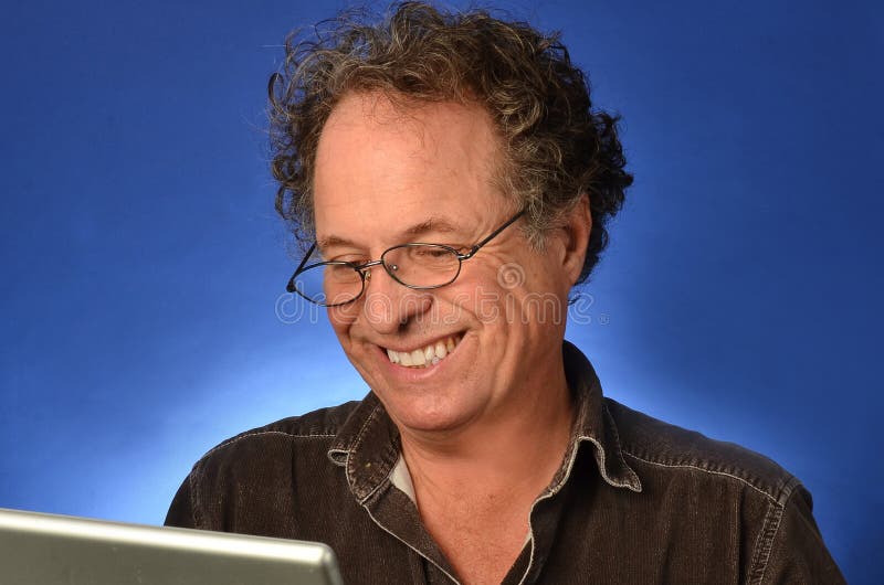 Mature Man on his computer stock photo. Image of retirement - 32290062