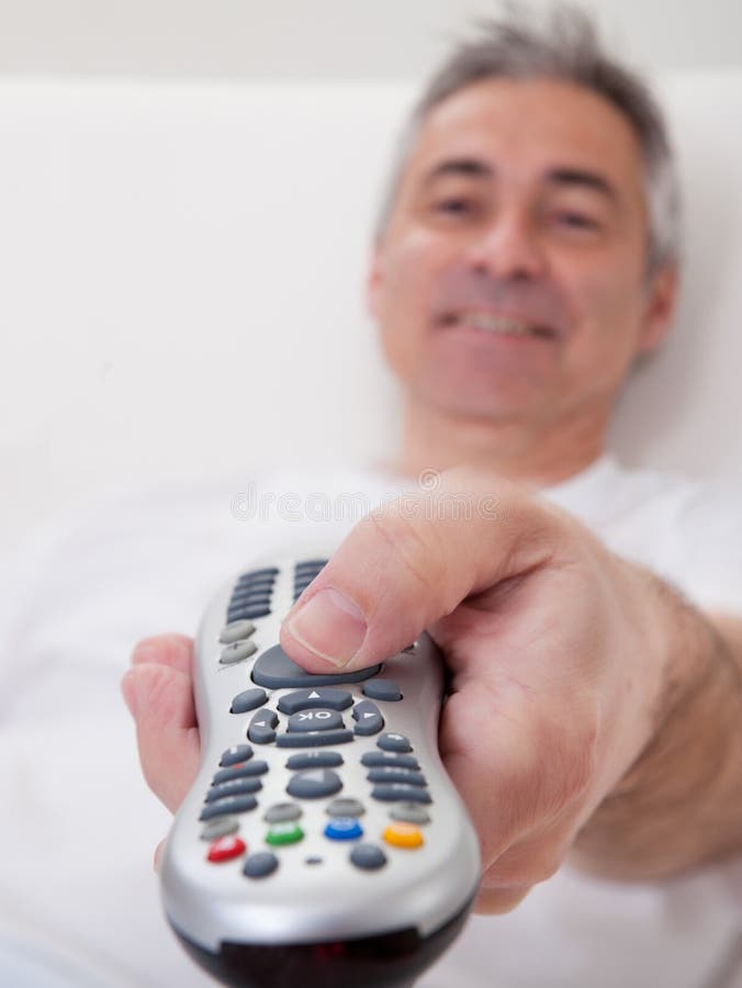 Mature Man Holding Remote Control Stock Photo - Image of mature, modern ...