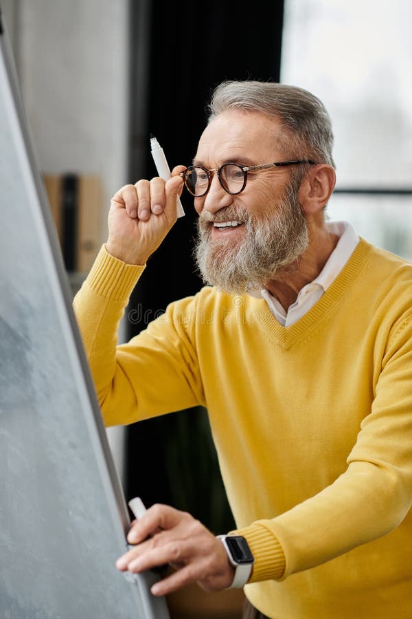 Mature Man Joyfully Drawing on a Stock Image - Image of professional ...