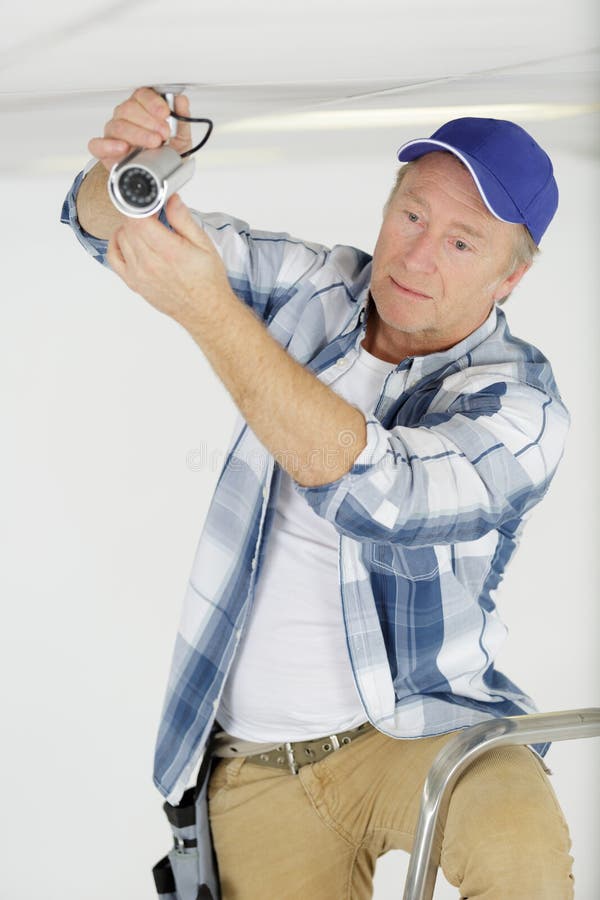 Mature Man Mounting Cctv Camera Stock Photo - Image of monitoring ...