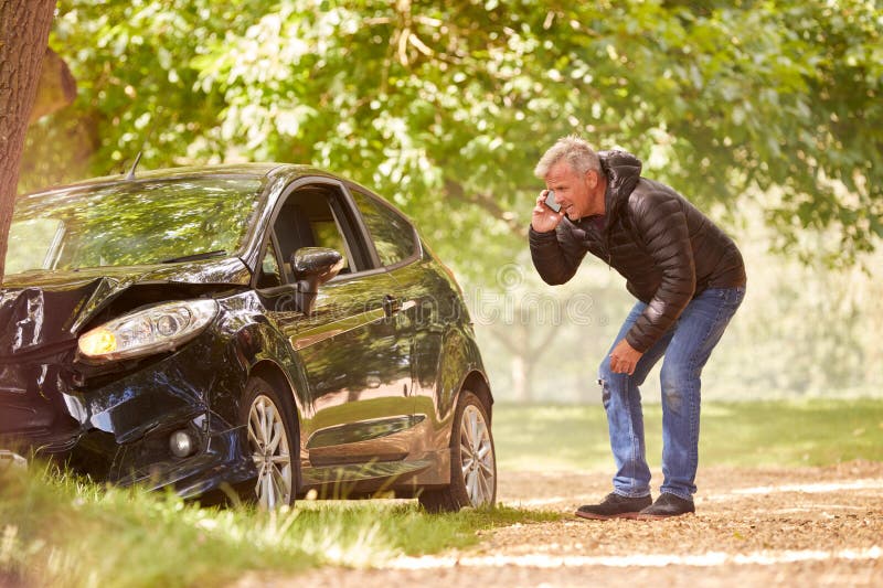 Driver Inspecting Damage after Traffic Accident Stock Photo - Image of ...