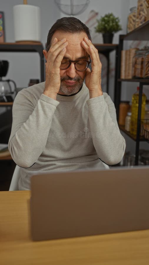 Mature Man in Office Looking Stressed with Hands on Head at Laptop Desk ...