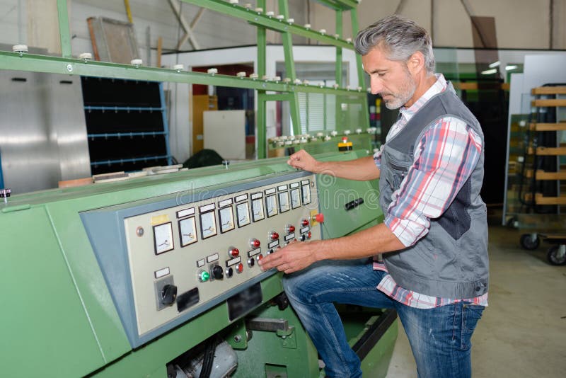 Mature Man Operating Industrial Machine Stock Image - Image of metal ...