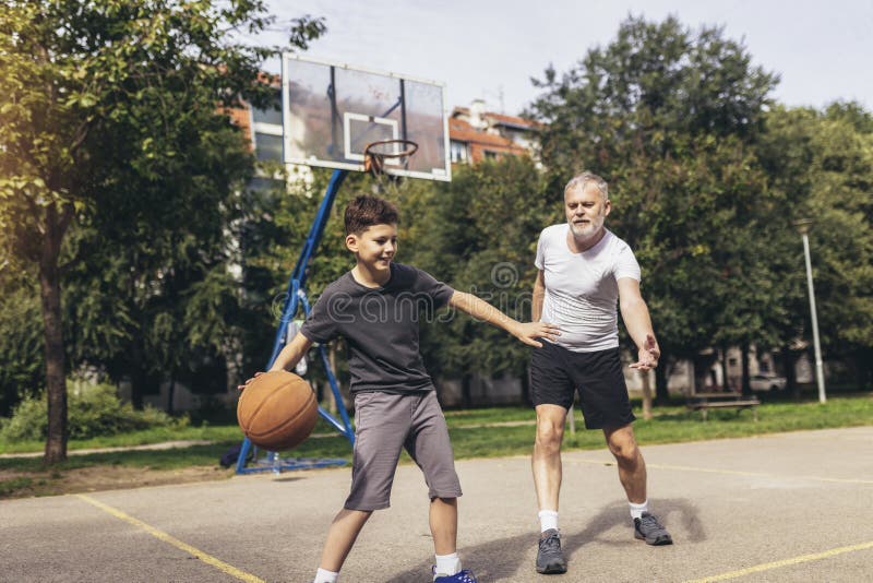 Mature Man Playing Basketball with His Son Stock Photo - Image of ball ...
