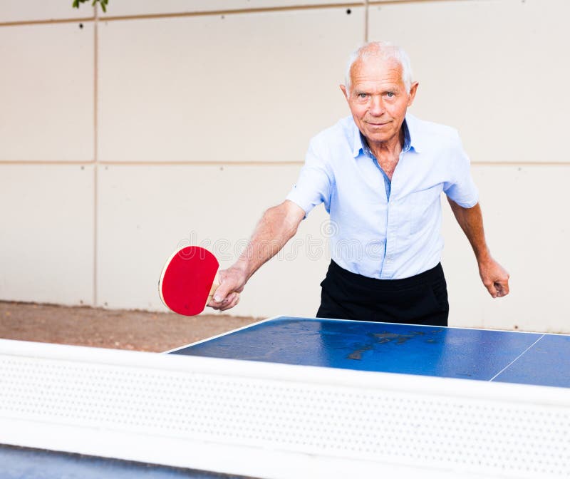 Mature Man Playing Ping Pong Outdoors Stock Photo - Image of middle ...
