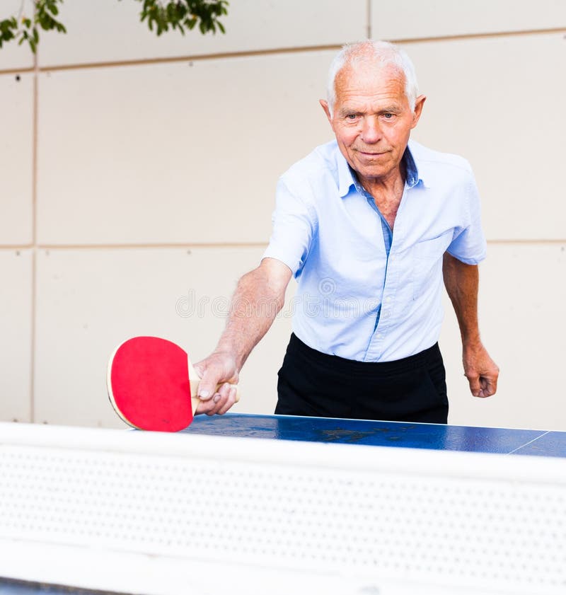 Mature Man Playing Ping Pong Outdoors Stock Photo - Image of ...