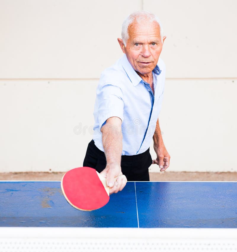 Mature Man Playing Ping Pong Outdoors Stock Photo - Image of natural ...
