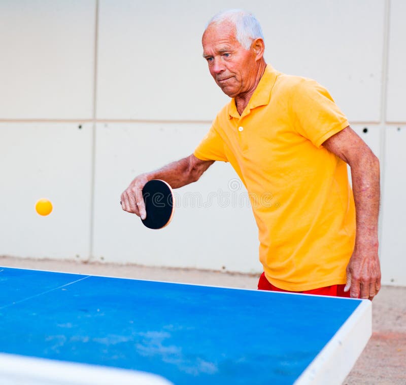 Mature Man Playing Ping Pong Outdoors Stock Image - Image of people ...