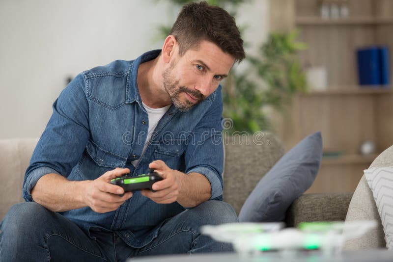 Mature Man Plays Video Games Stock Photo - Image of digital, gadget ...